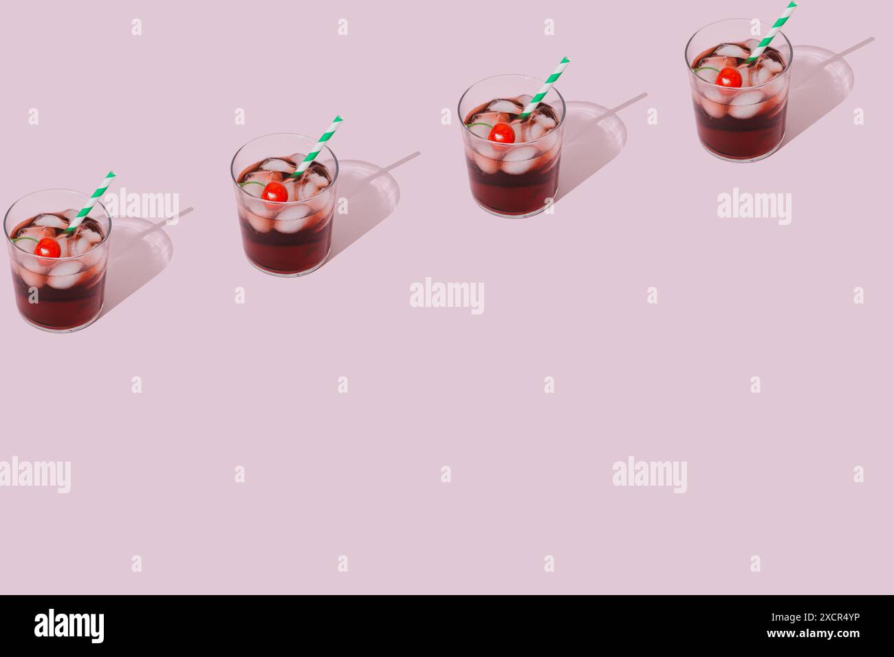 Pattern of cherry juice cocktail with green and white paper drinking ...