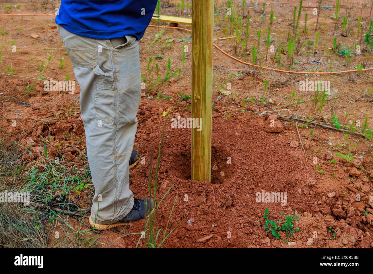 Fence post installation hi-res stock photography and images - Alamy