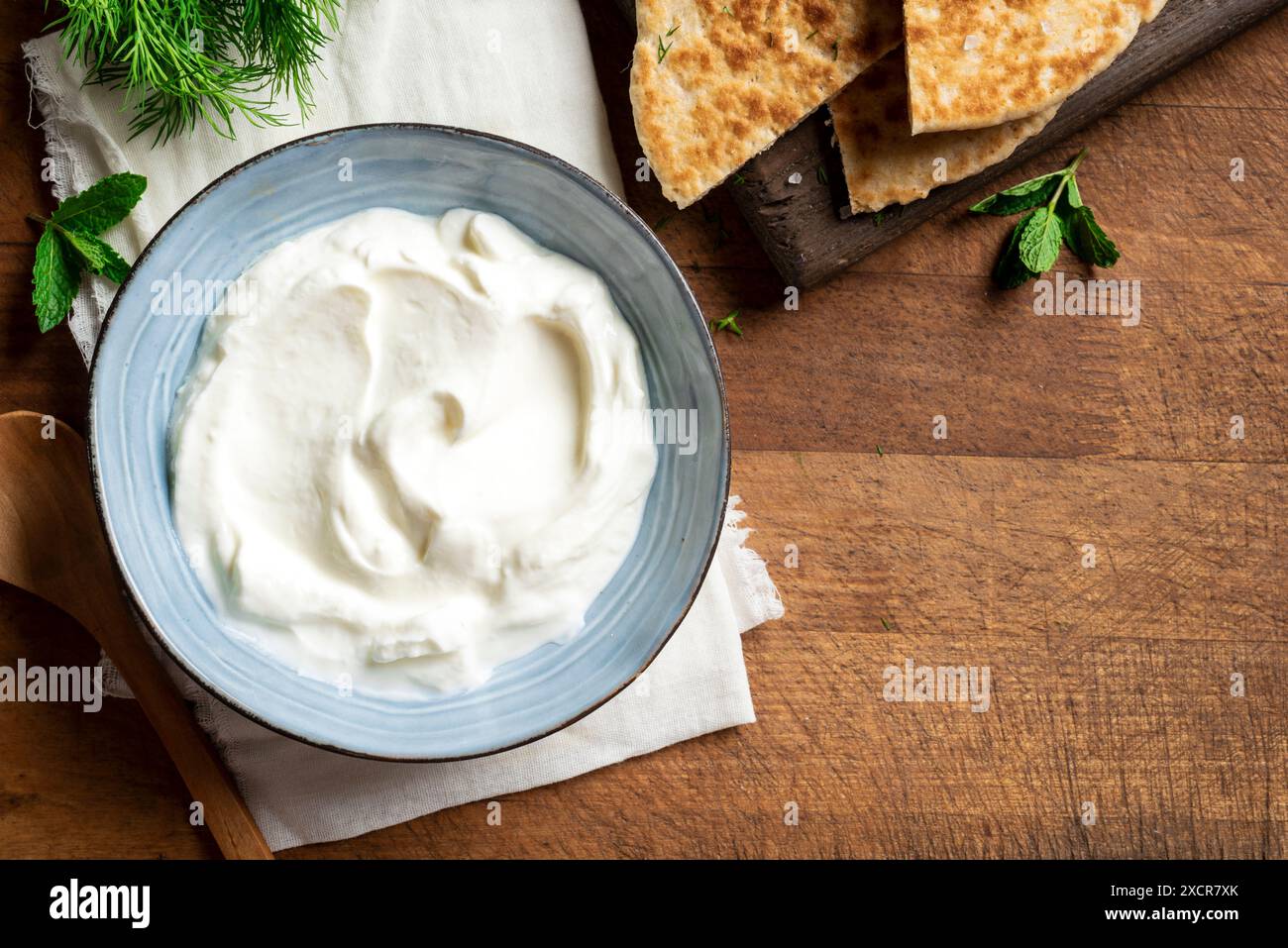 Homemade Yogurt Labneh Cheese Dip and Pita Bread for traditional middle ...