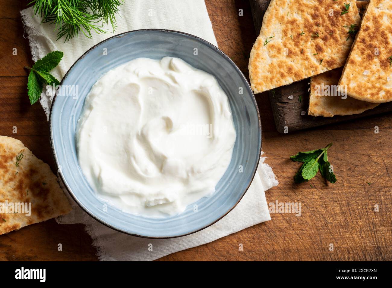 Homemade Yogurt Labneh Cheese Dip and Pita Bread for traditional middle ...