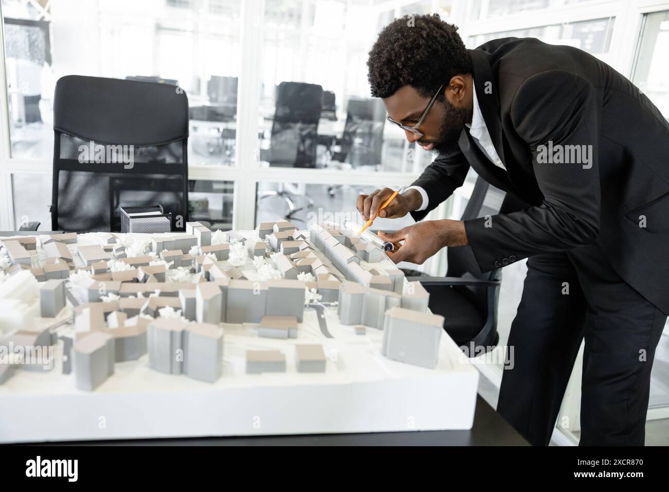 Hard working man architect conceptualizing new exterior designs in the ...