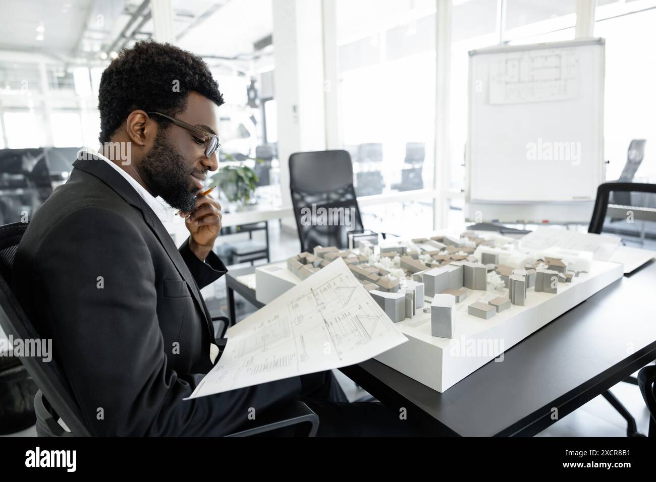 Professional man architect solving engineering problems in his ...