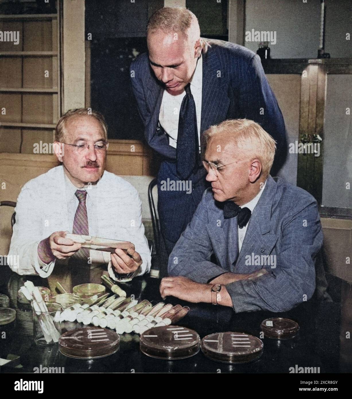 Selman Waksman (left) talking to Sir Alexander Fleming (right) and ...