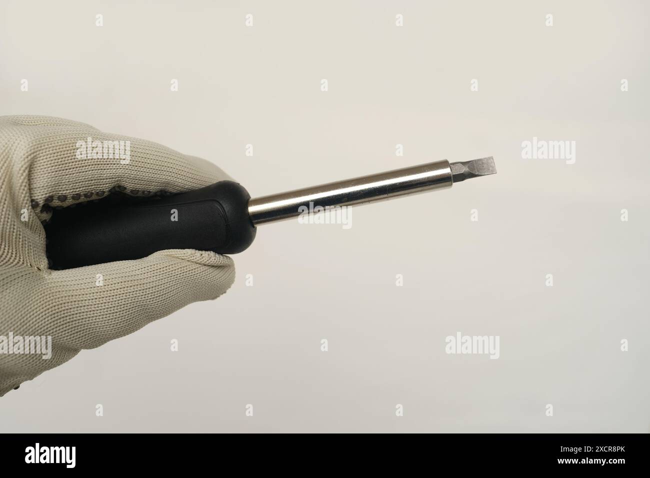 manual technical instrument screwdriver in craftsman's hand, tool ...