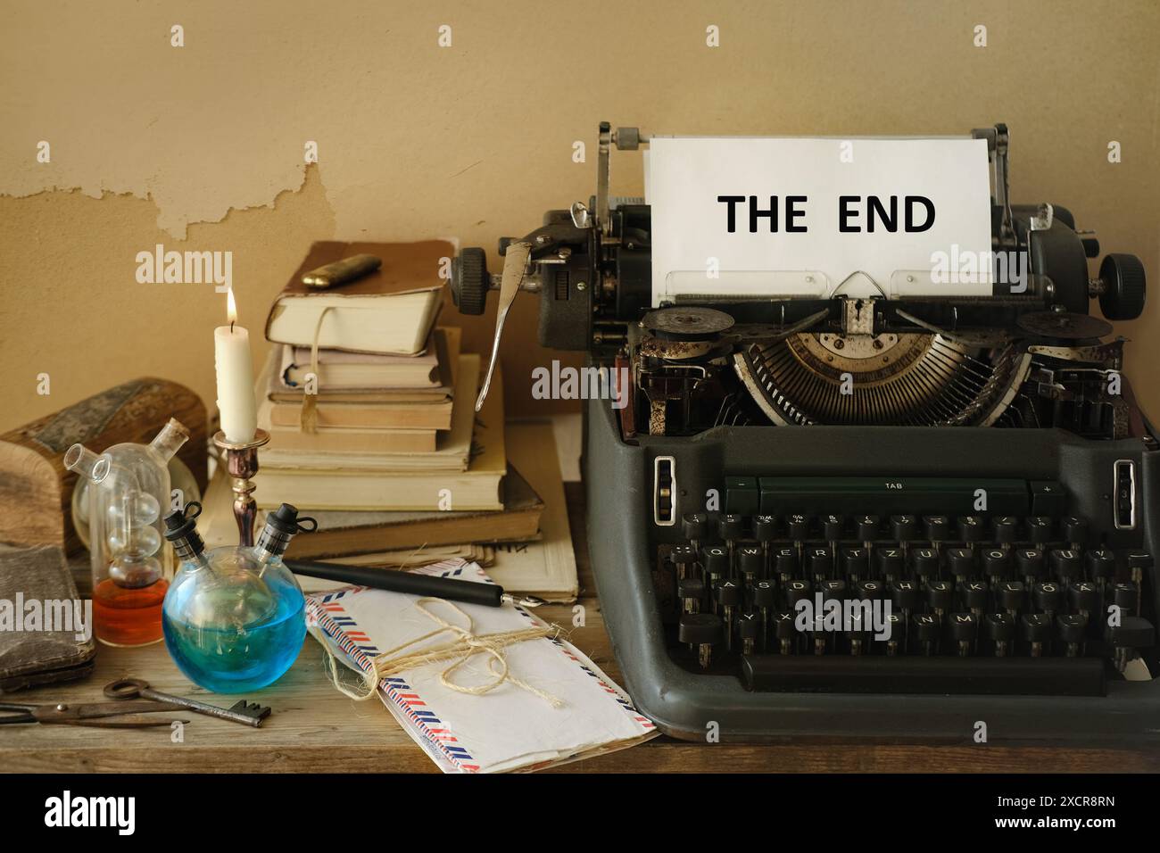 candle burning in candlestick, stack old books, letters, vintage ...