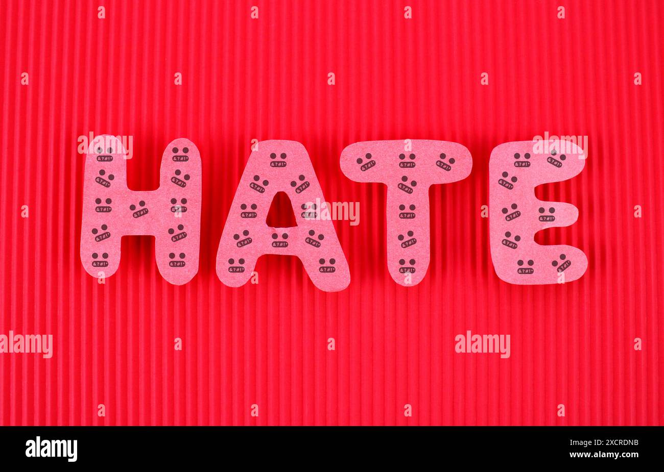 Word hate with various expressions of disgust on it Stock Photo - Alamy