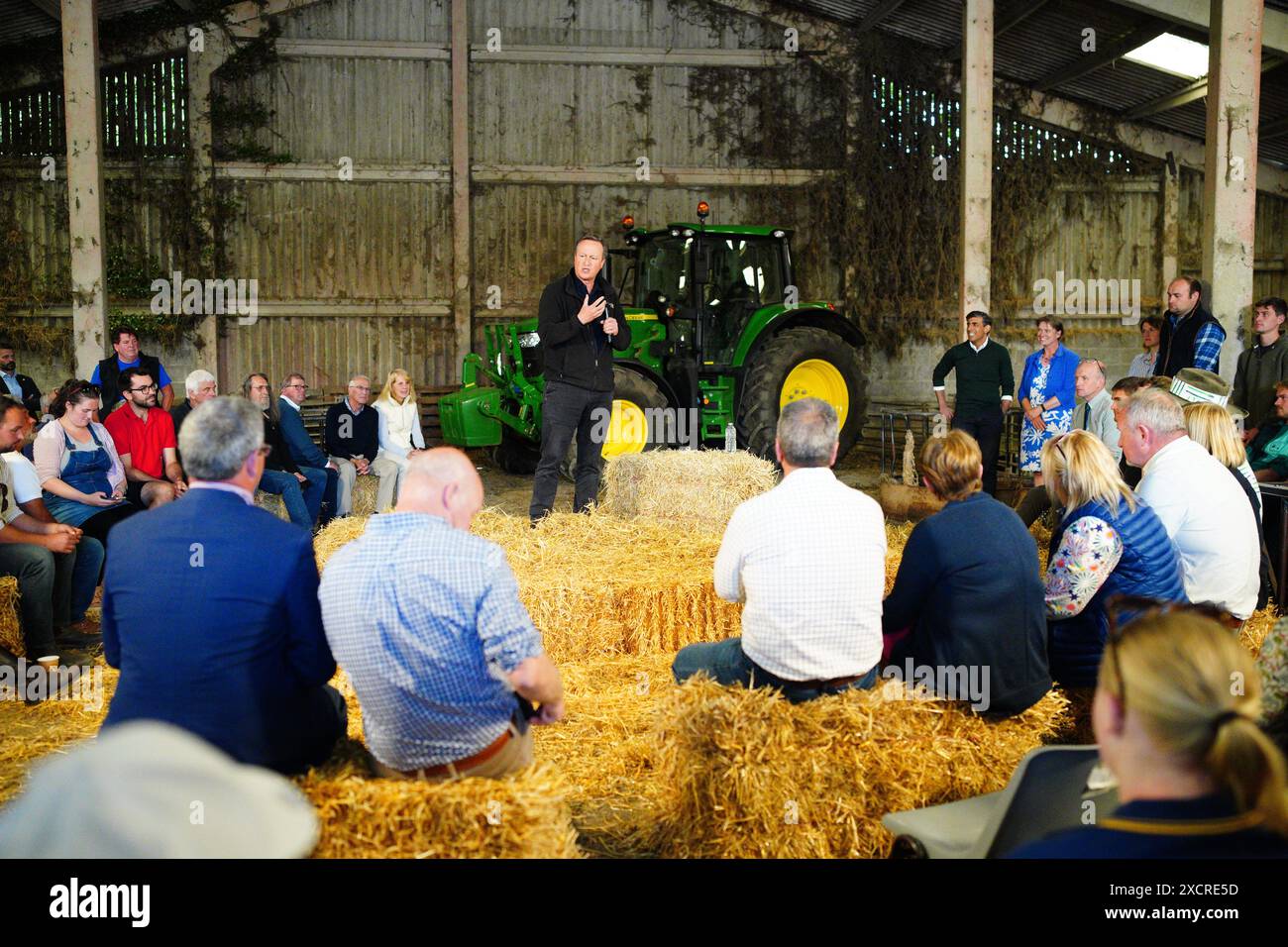Foreign Secretary Lord David Cameron (centre), watched by Prime Minister Rishi Sunak, answers ...