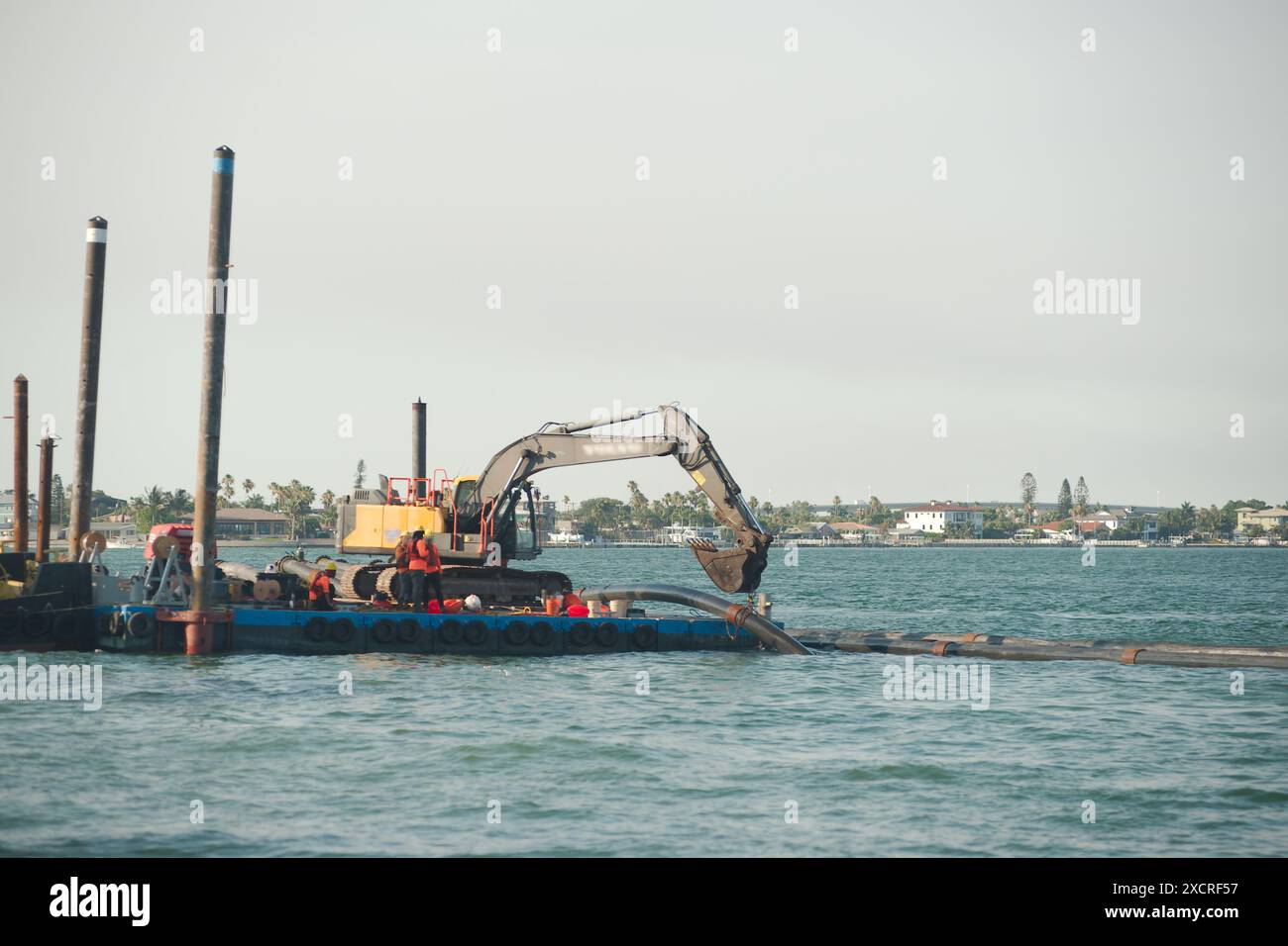 Side Wide view of Looking out to Pass-a-grille channel. Dredge boat ...