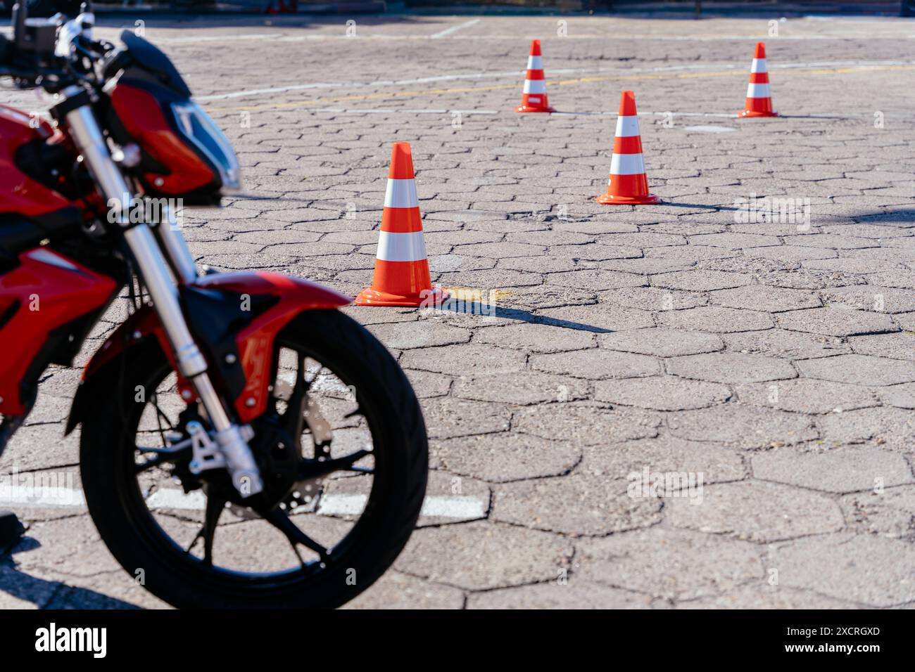 Concept of motorcycle school of driving. Riding between cones, lesson ...