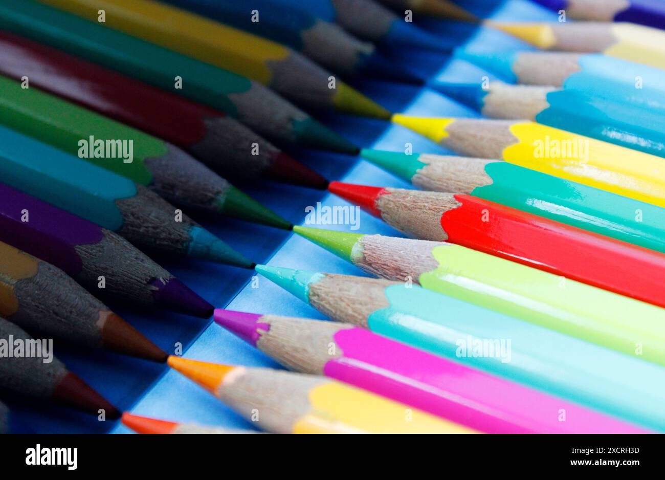Reflection of colored pencils on dark screen Stock Photo - Alamy
