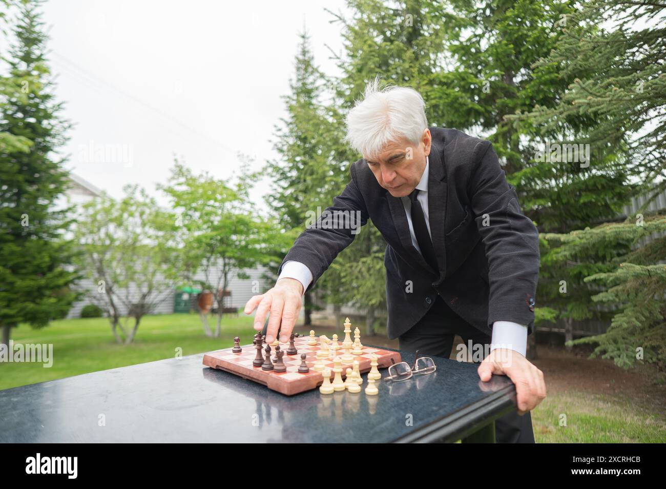 Old man playing chess alone hi-res stock photography and images - Alamy