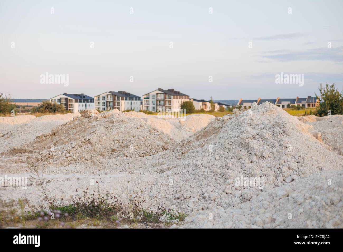 Construction site with mound of sand and soil. Preparation for building ...