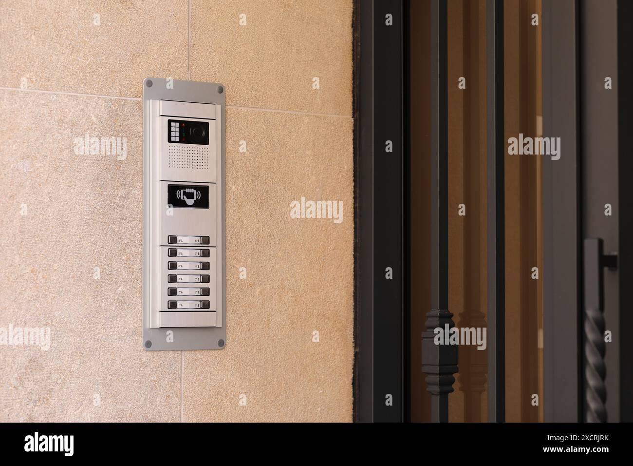 Close up entrance door intercom. Modern doorbells with 6 empty name tag ...
