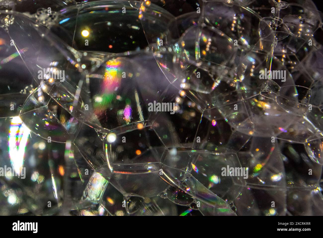 Abstract macro close up of bubble blowing multiple small bubbles with ...