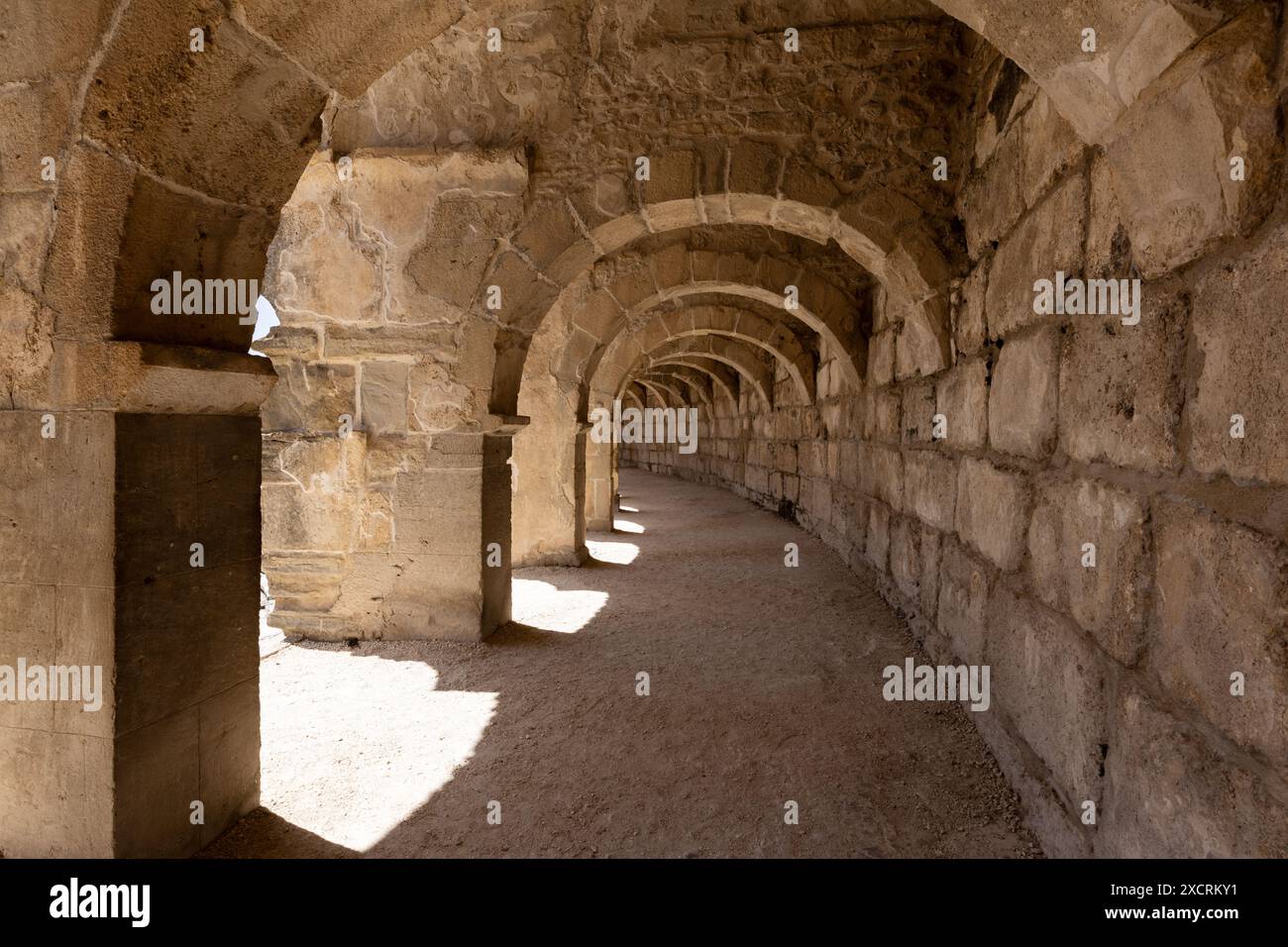 The columns of the concourse walkway at the top of the ancient theatre ...