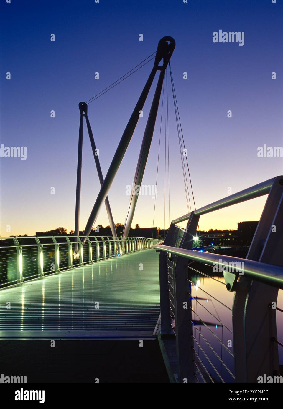 Iconic pedestrian cable stayed footbridge over the river Usk at sunset ...