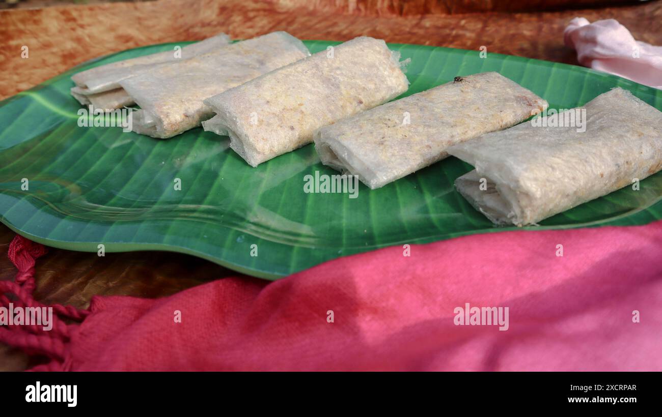 Traditional Andhra sweet Pootharekulu made from paper thin sheet made ...