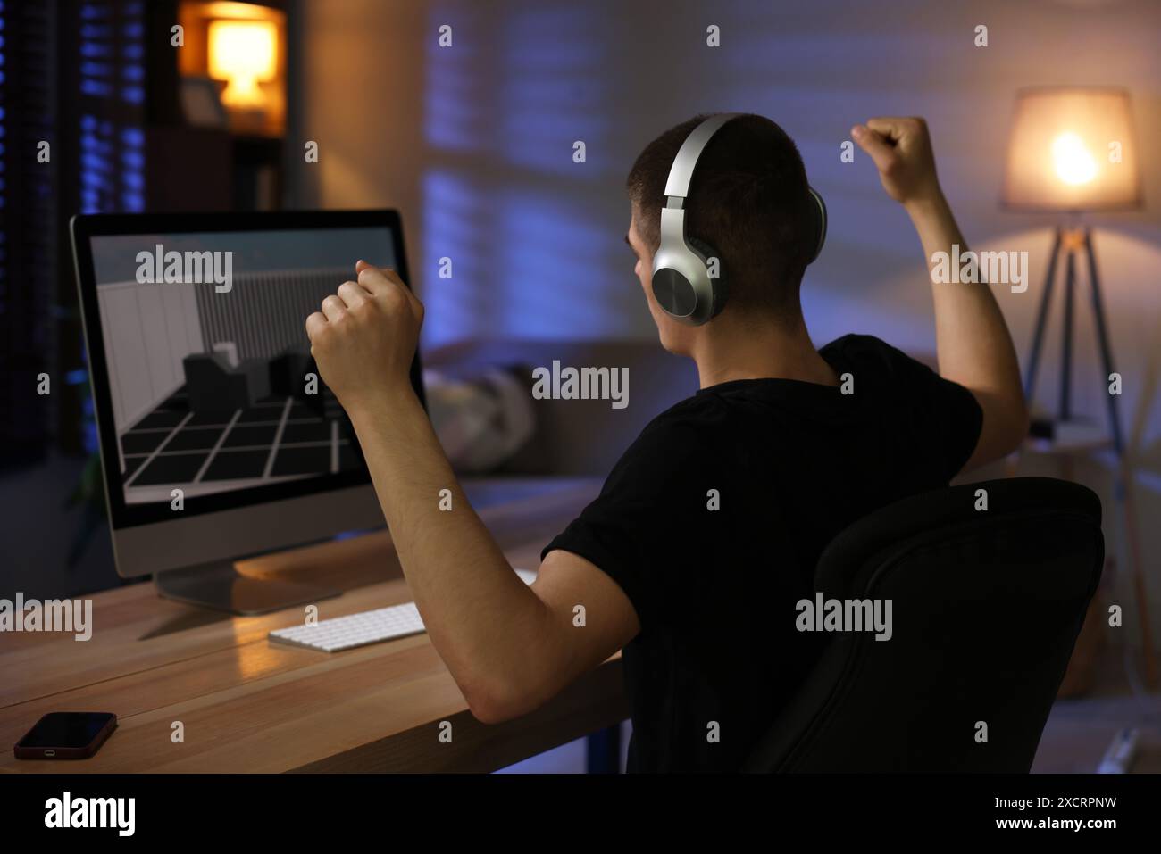 Playing computer games back view hi-res stock photography and images ...