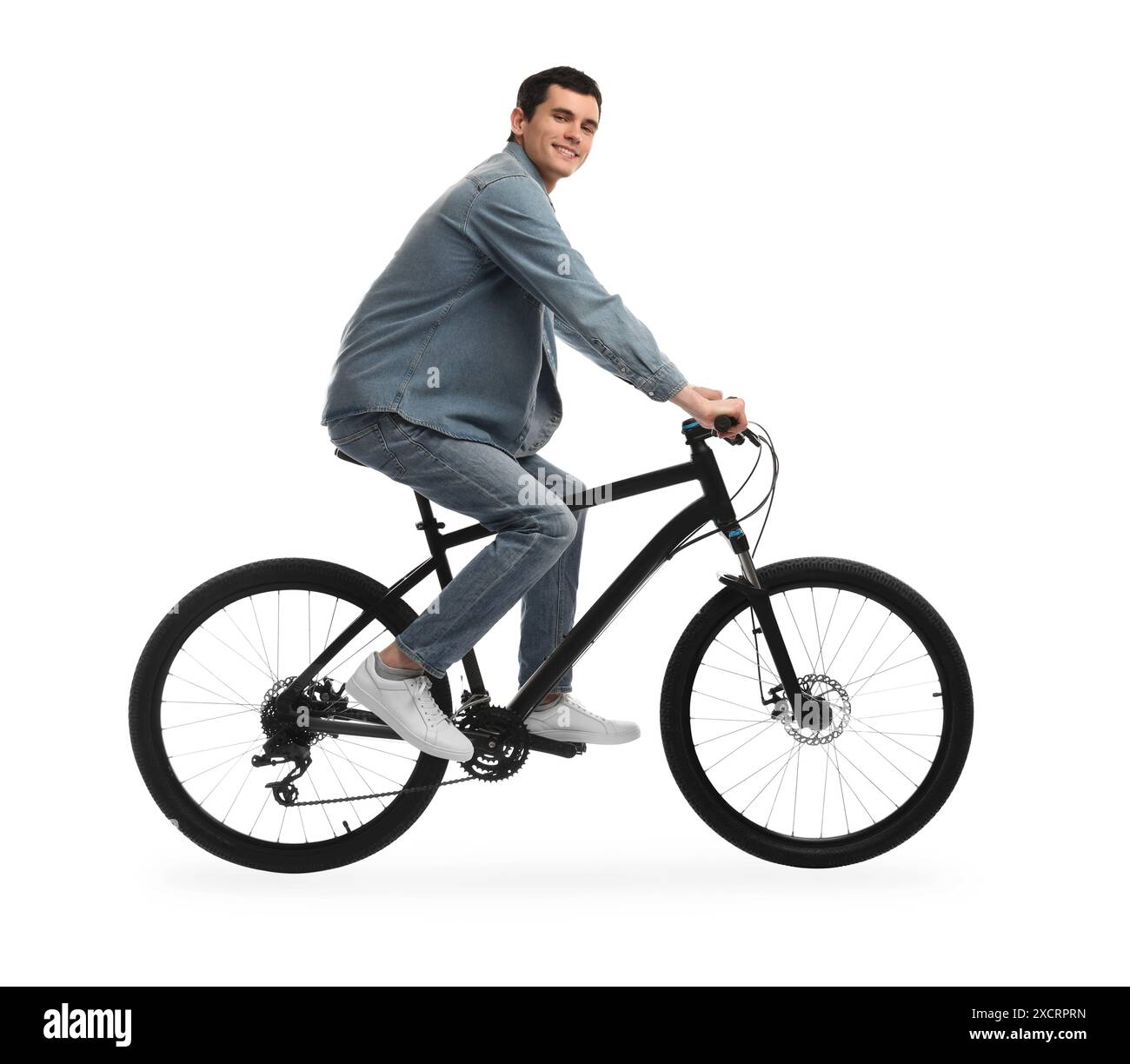 Smiling man riding bicycle on white background Stock Photo - Alamy