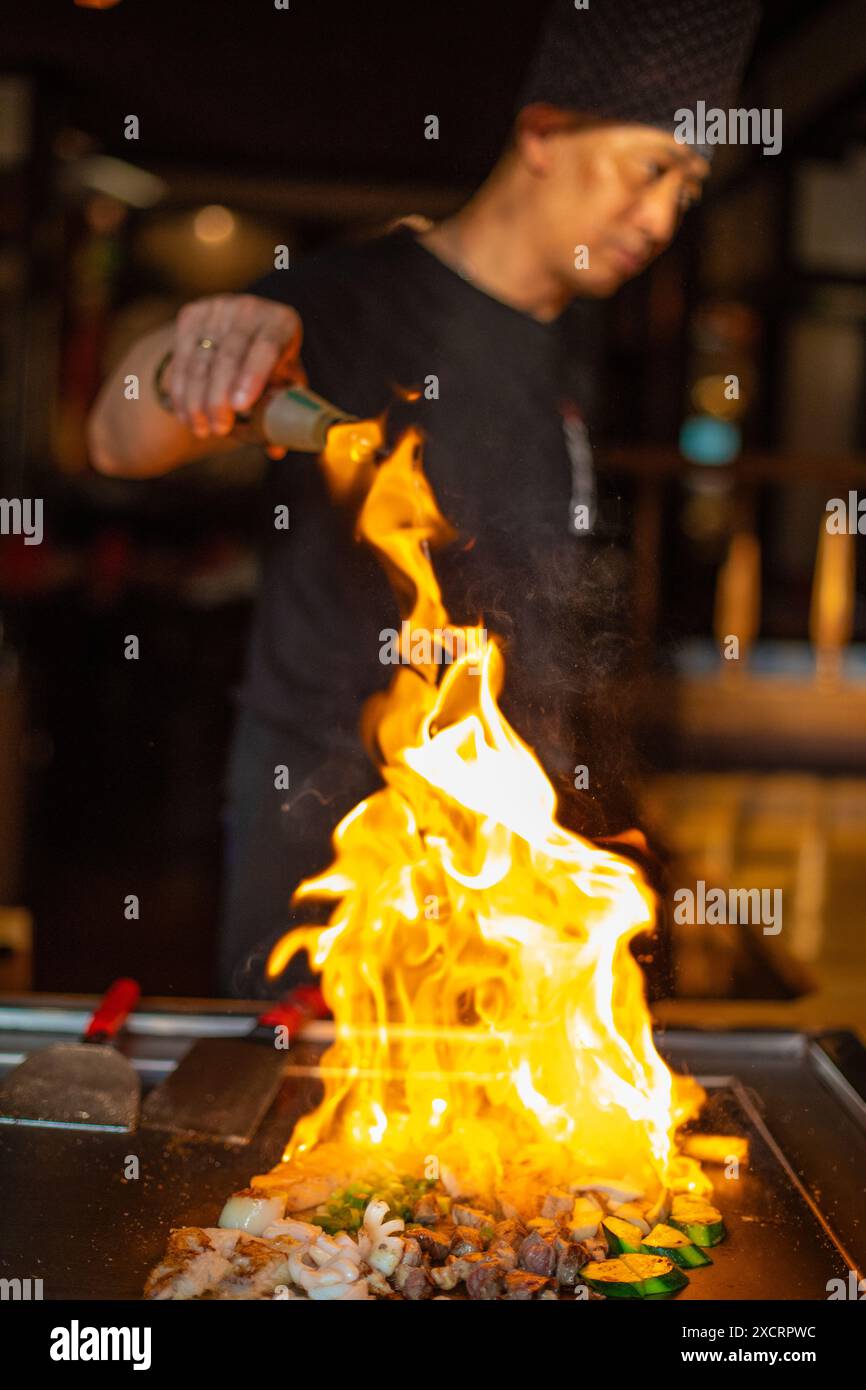 Berlin, Germany 08. 16. 2023. Teppanyaki chef cooking at teppan in a ...