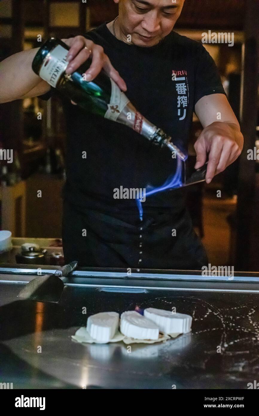Berlin, Germany 08. 16. 2023. Teppanyaki chef cooking at teppan in a ...