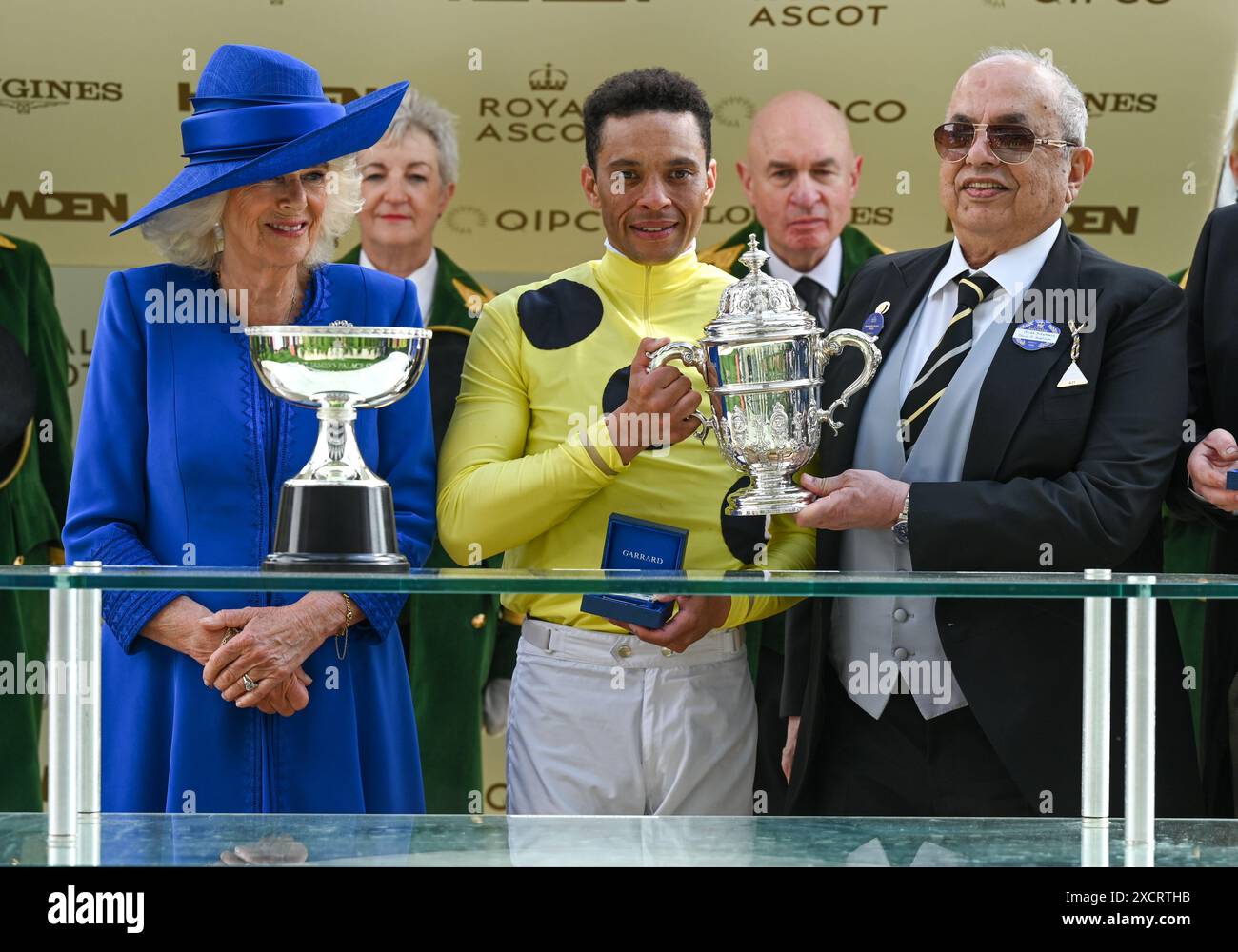 Ascot, UK. 18 June, 2024. HRH The Queen present the Trophy to Sean ...