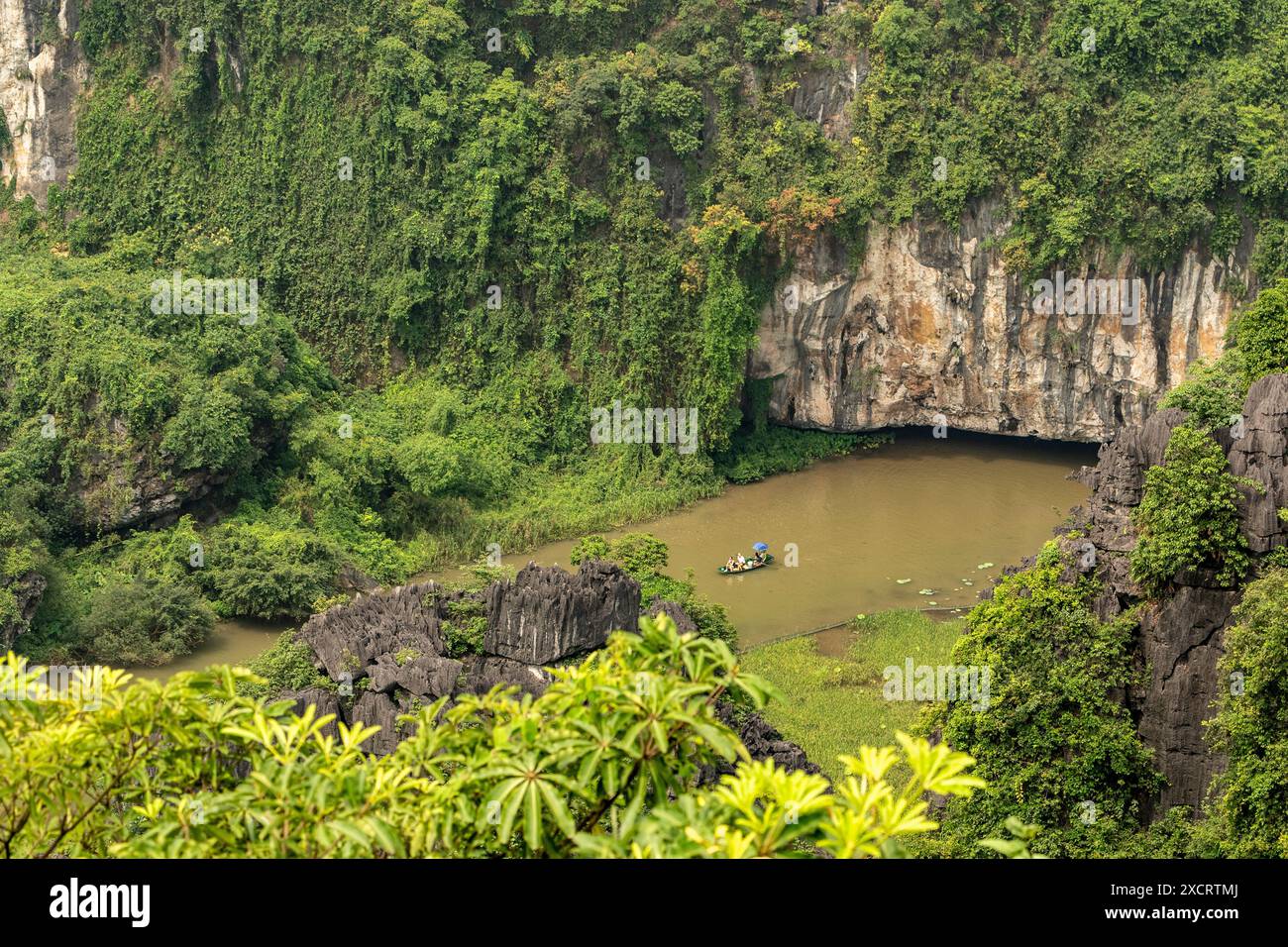 Breathtaking view of tourist sampans meandering along the Tam Coc river ...