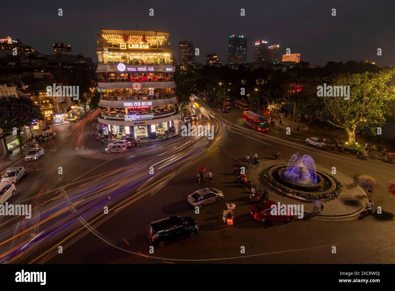 Spectacular high angle sunset / night image of Hanoi's Old Town main roundabout and fountain ...
