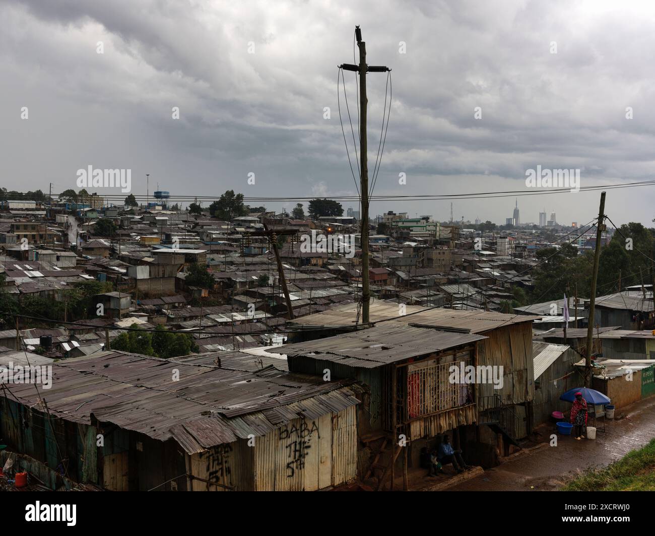 Cloudy sky over the rooftops of Kibera slum in Nairobi Kenya. An ...