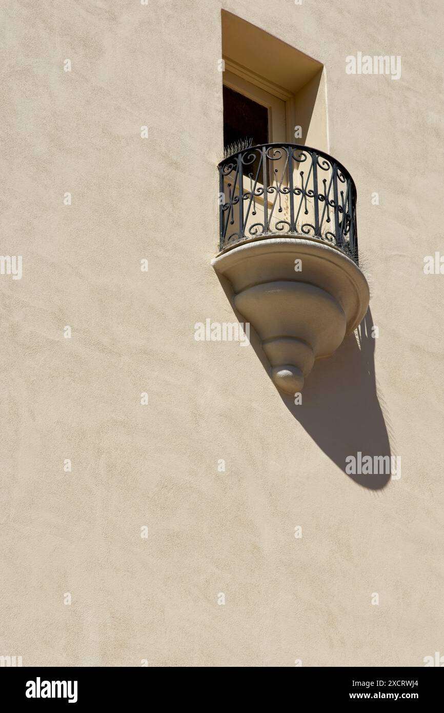 Ornate semi-circular window balcony with wrought iron railing Stock ...
