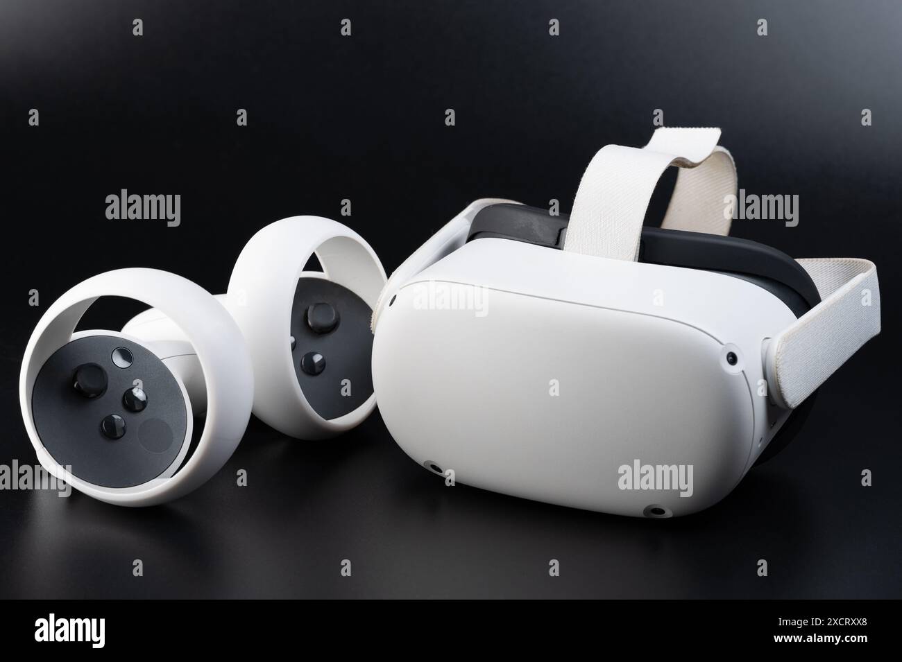 White plastic VR set kit with joystick isolated on black studio ...