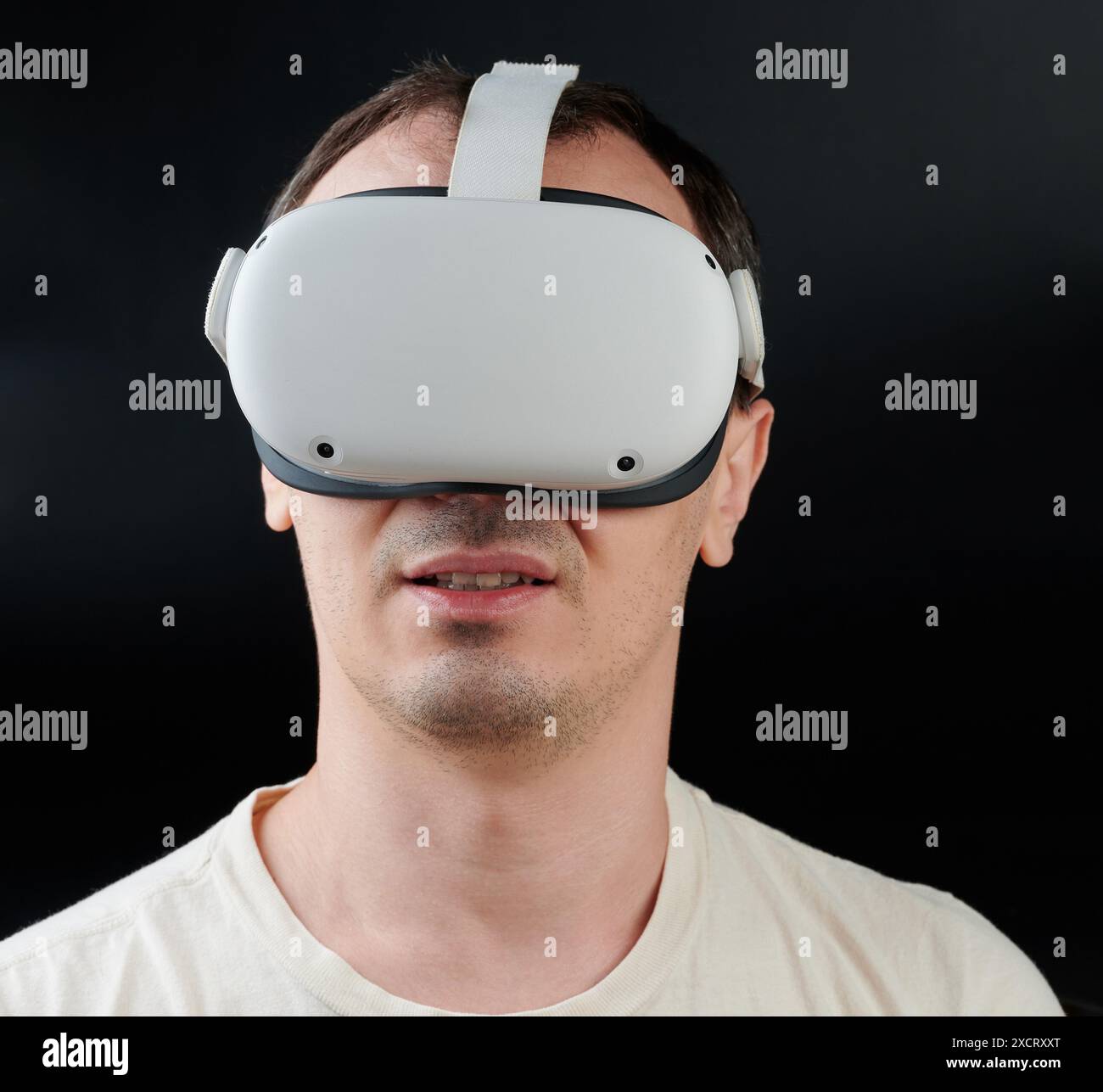 Vr gadget on man head front view isolated on black studio background ...