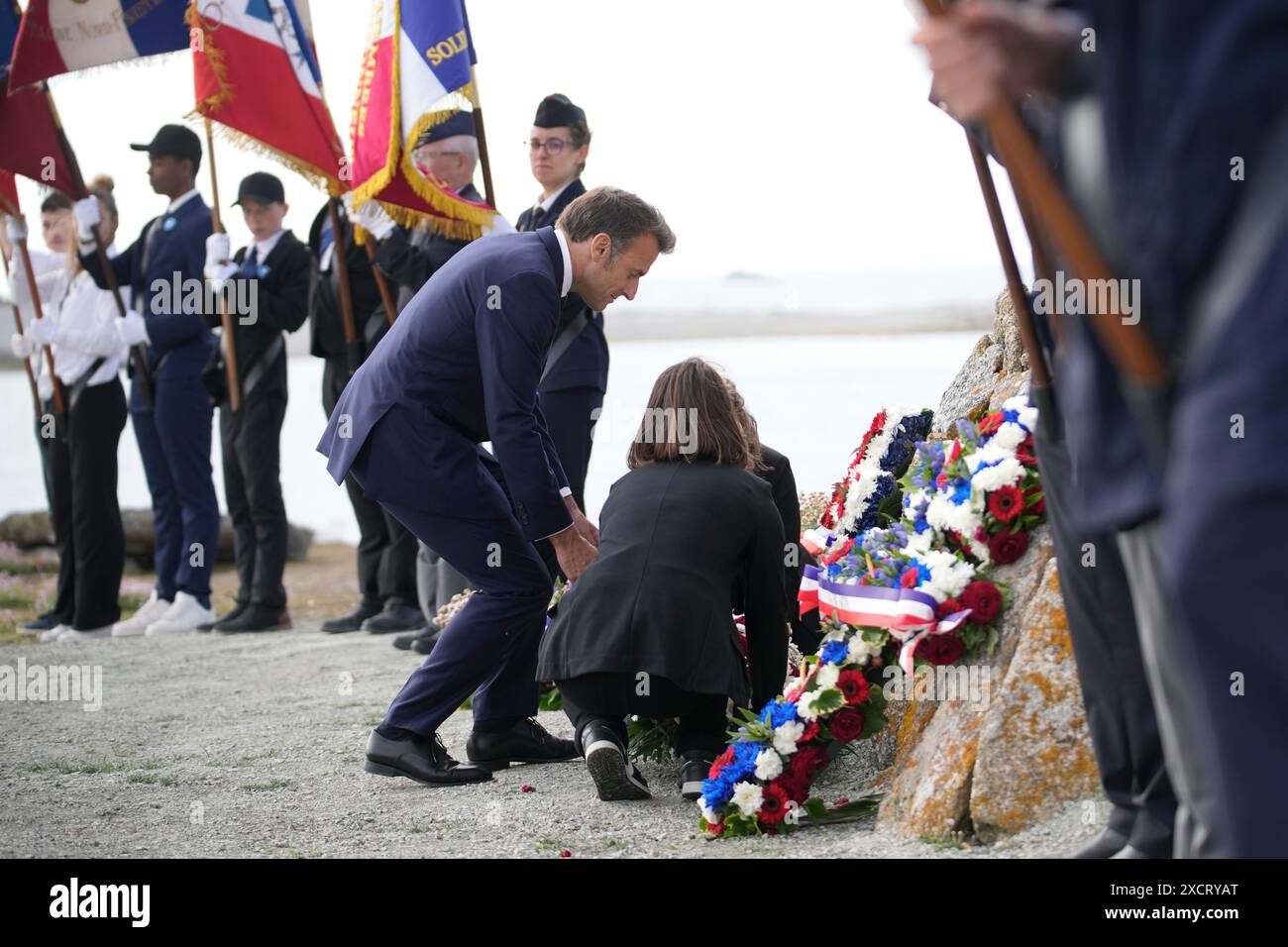 French President Emmanuel Macron lays a wreath of flowers at the Croix ...