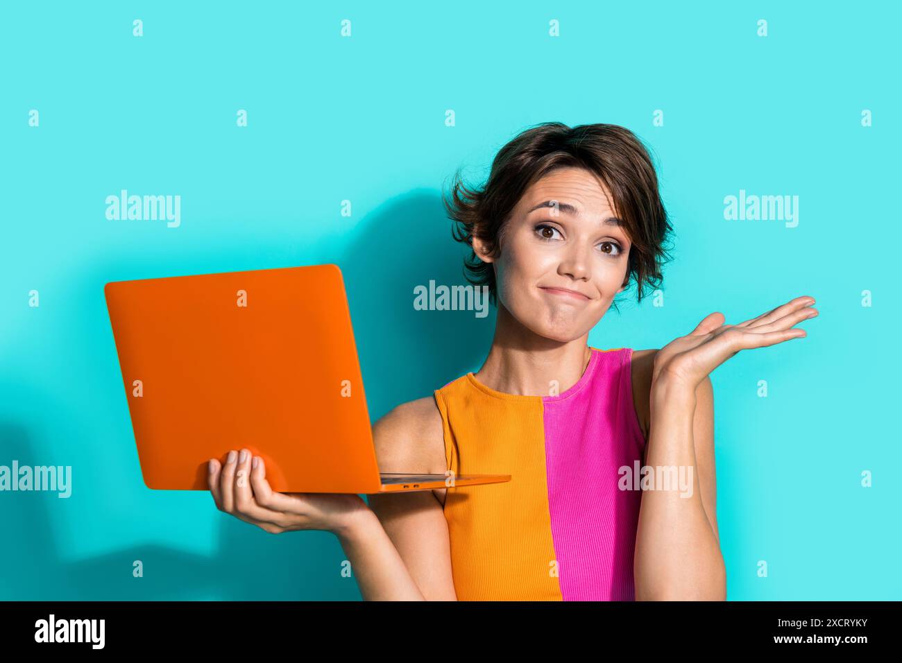 Photo of doubtful unsure lady dressed colorful top shrugging shoulders ...