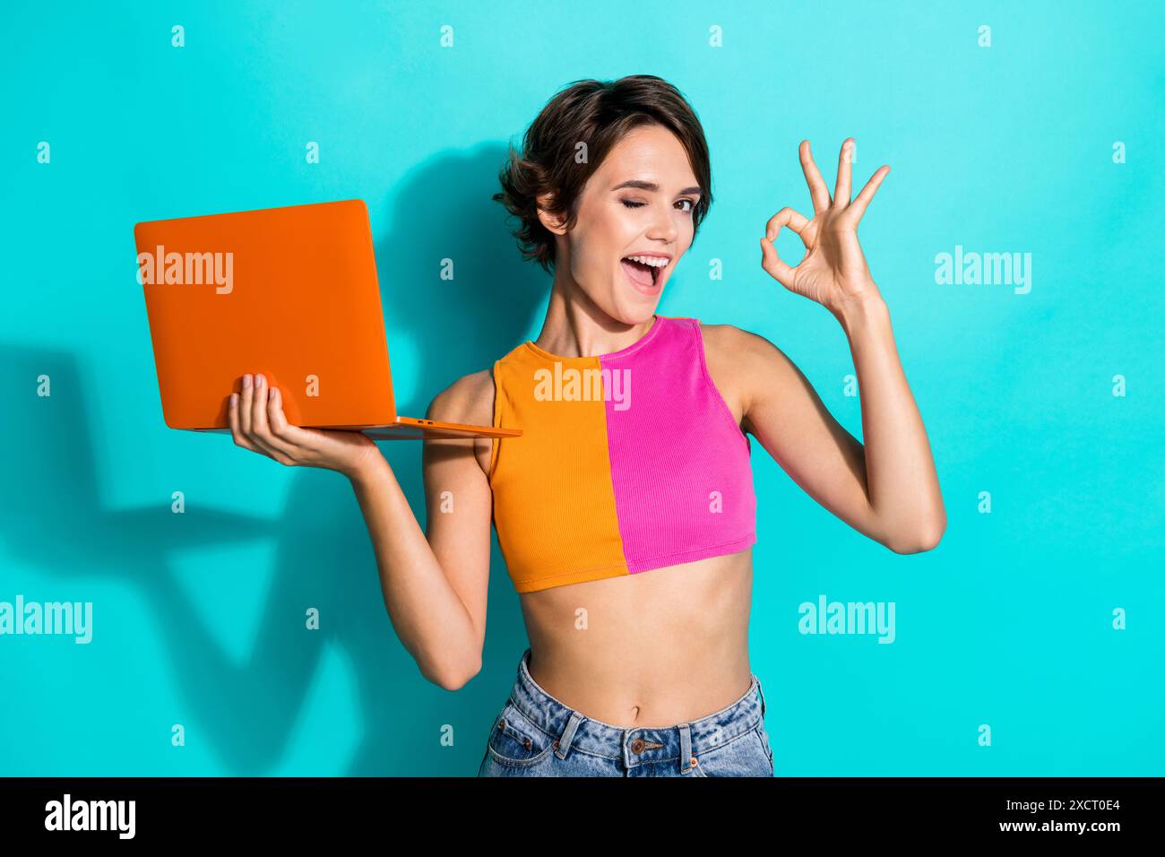 Photo of pretty flirty lady dressed colorful top working modern device ...