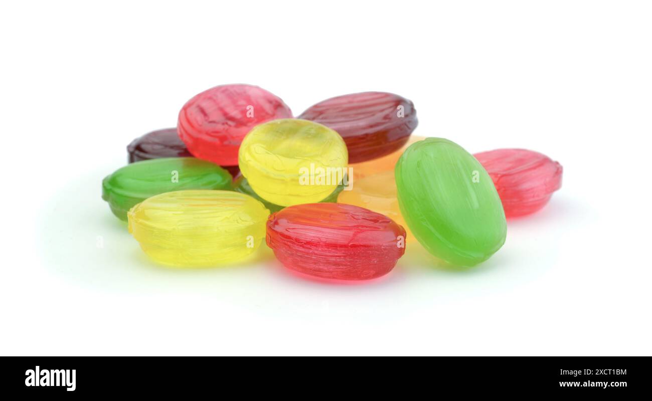 Pile of colorful fruit candies isolated on white Stock Photo - Alamy