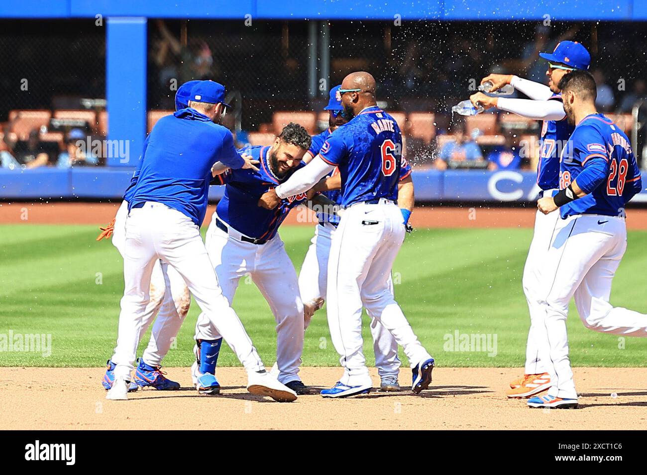New York Mets Omar Narváez #2 is mobbed by teammates after his game ...