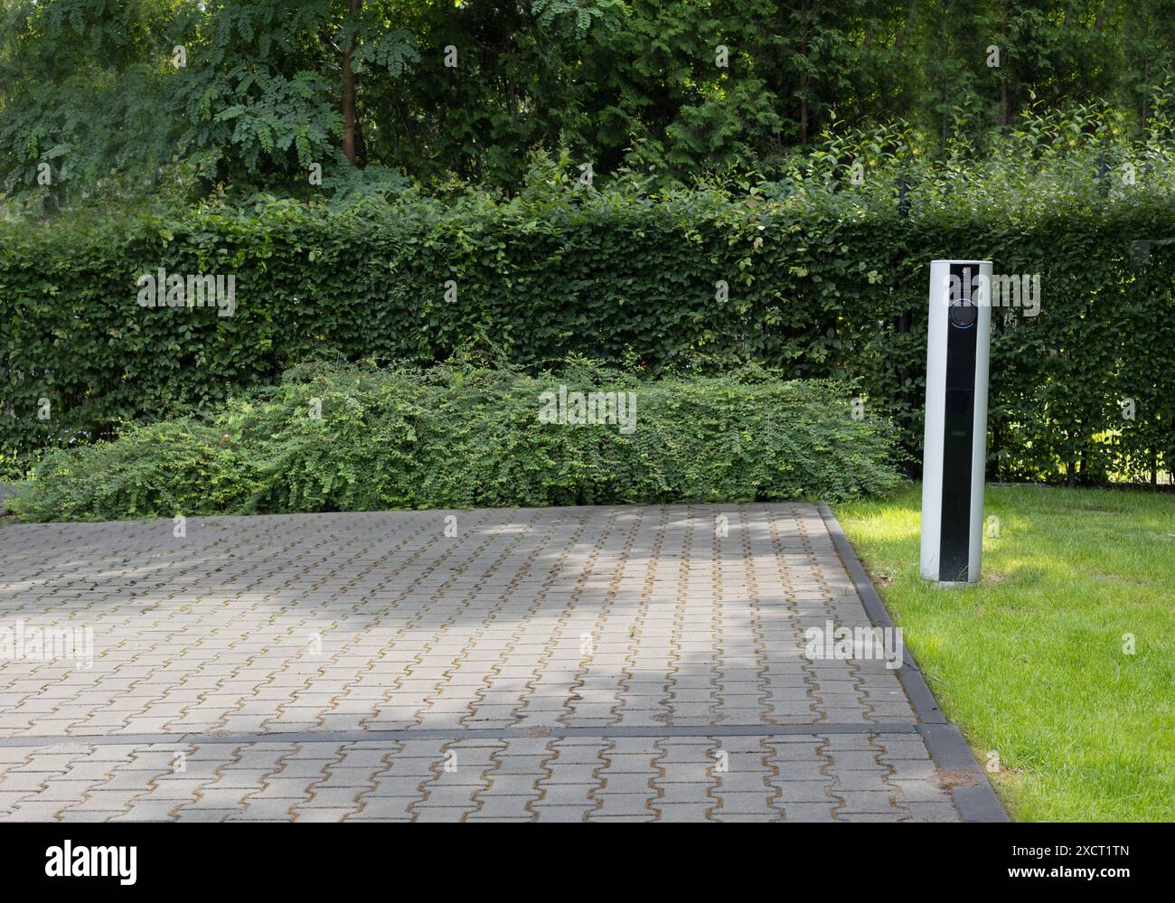 EV Charging Spot with Empty Parking Space Stock Photo - Alamy