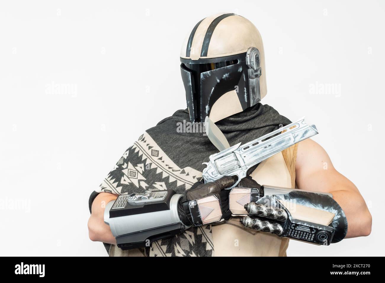 A male cosplayer dressed as a Star Wars character Mandalorian at Comic ...