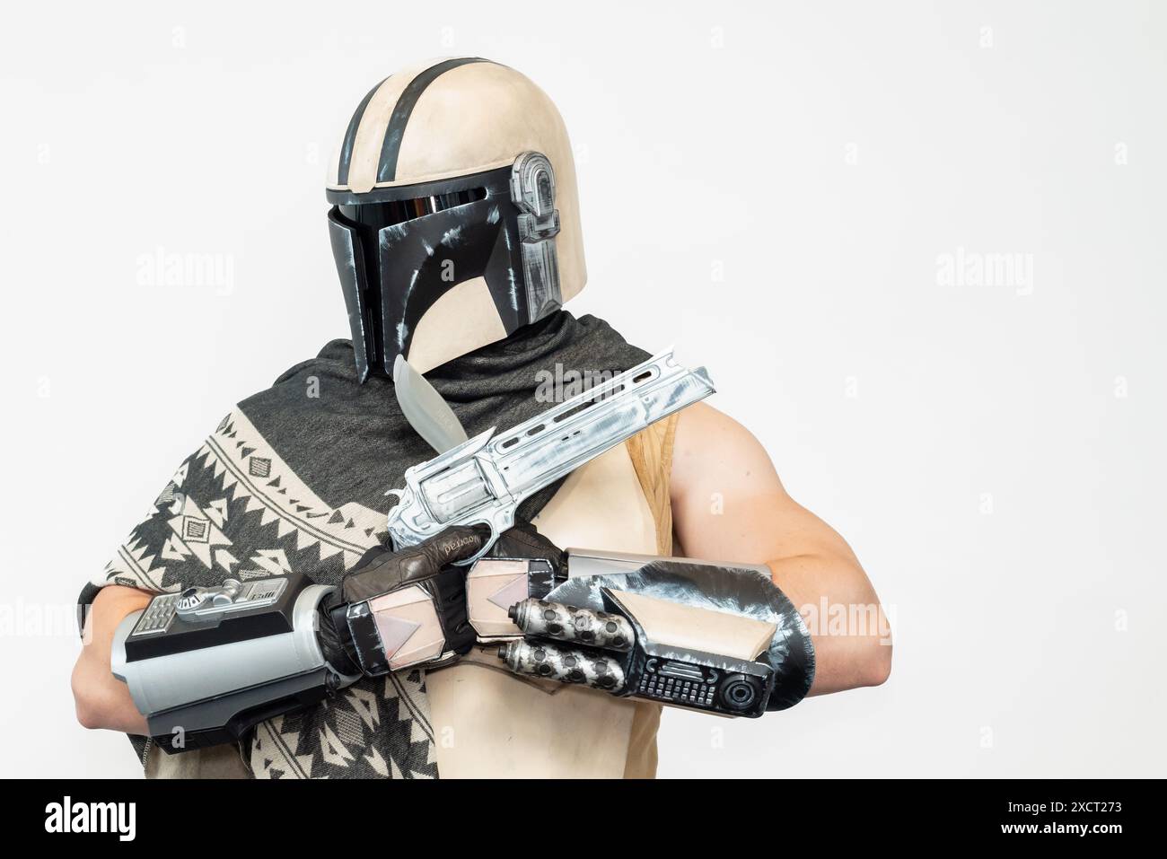 A male cosplayer dressed as a Star Wars character Mandalorian at Comic ...