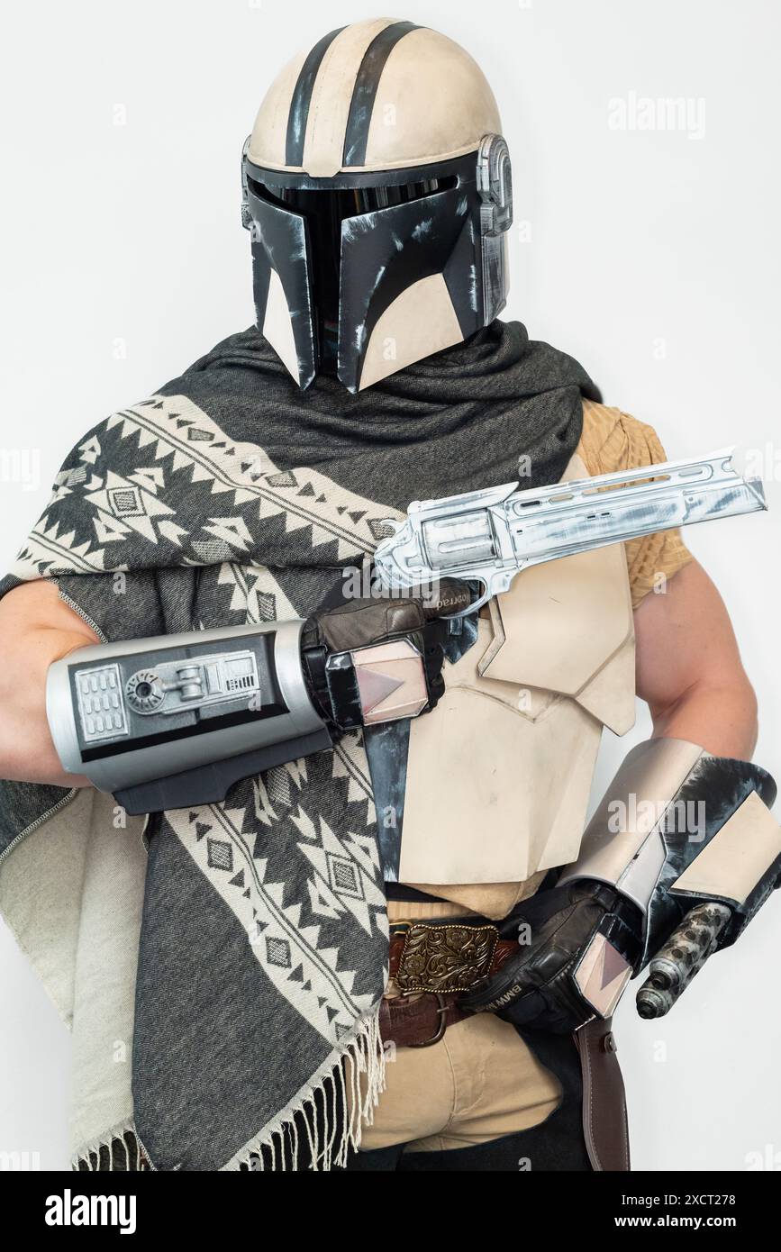 A male cosplayer dressed as a Star Wars character Mandalorian at Comic ...
