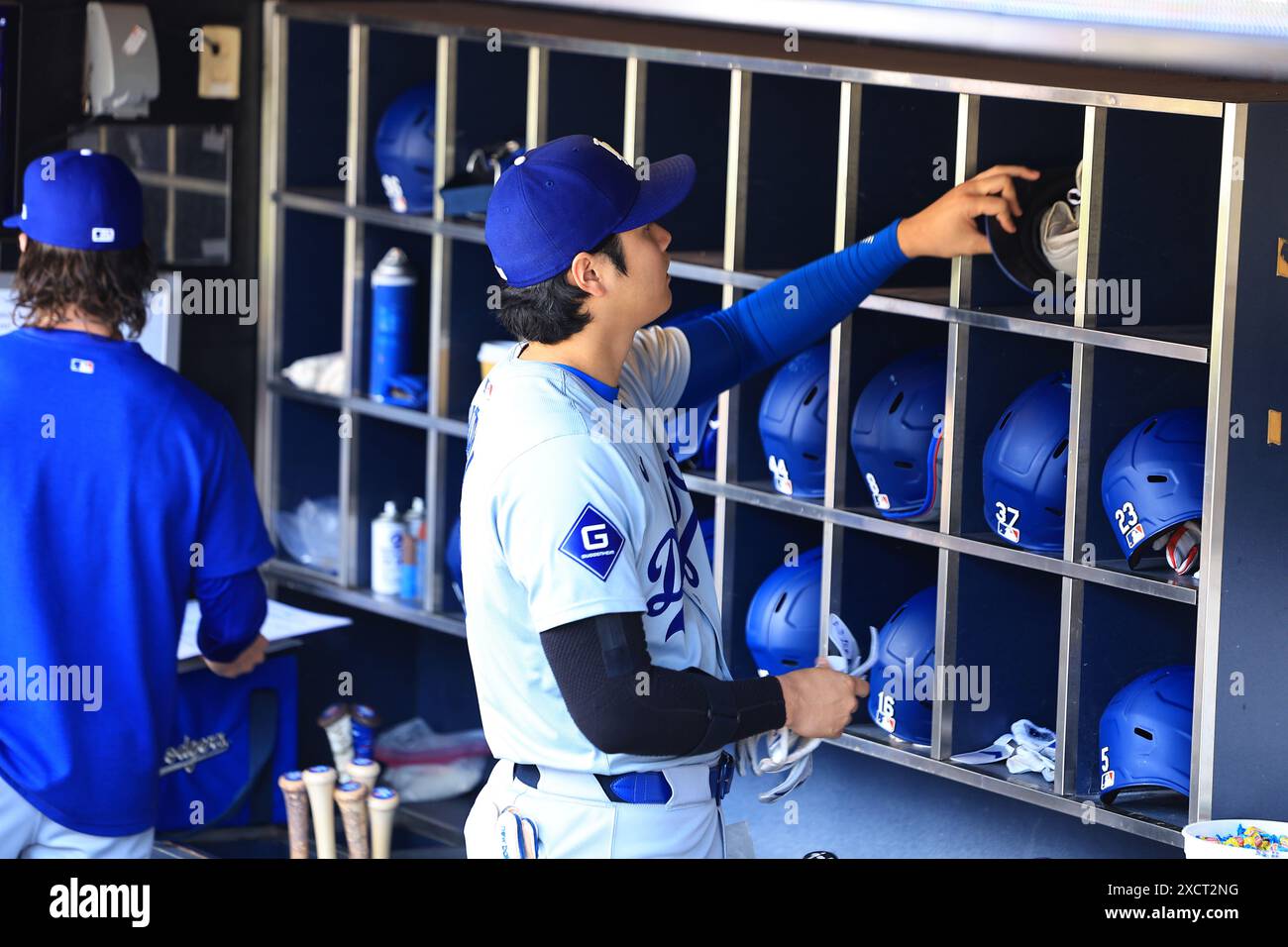 Los Angeles Dodgers Shohei Ohtani #17 stands in the dugout before the ...