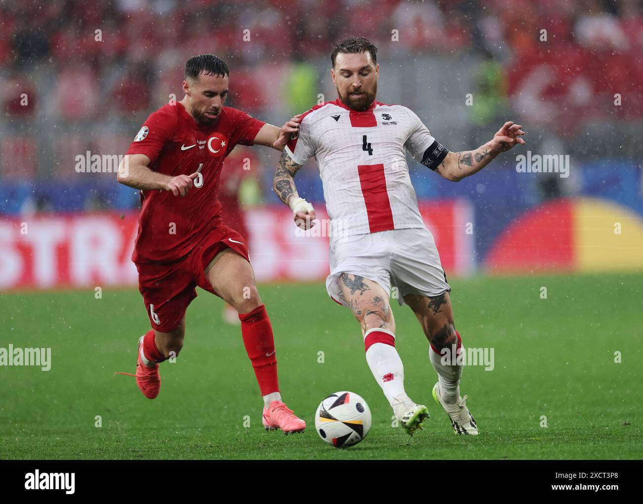 Dortmund, Germany, 18th June 2024. Guram Kashia of Georgia (r) tackled ...