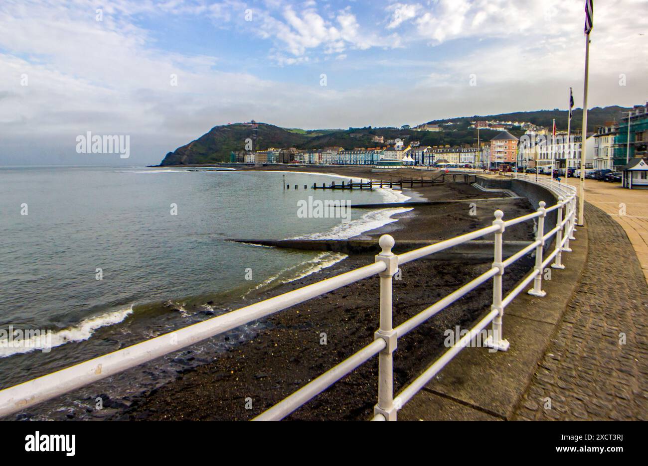 View along the walkway of the promenade of Aberystwyth in Wales with ...