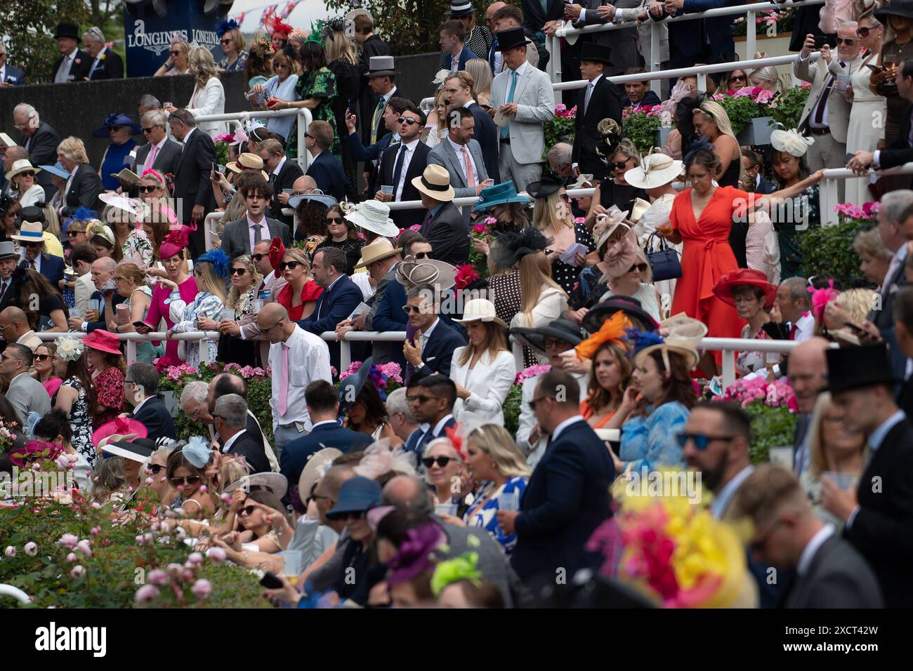 Racegoers in the Parade Ring waiting fo for the Royal Procession on day ...