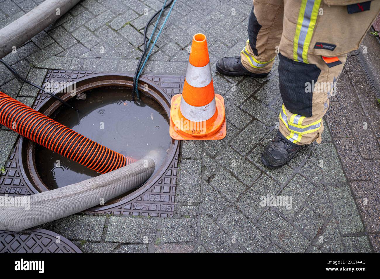 Lier, Belgium. 18th June, 2024. Firefighters work to clear flooded ...