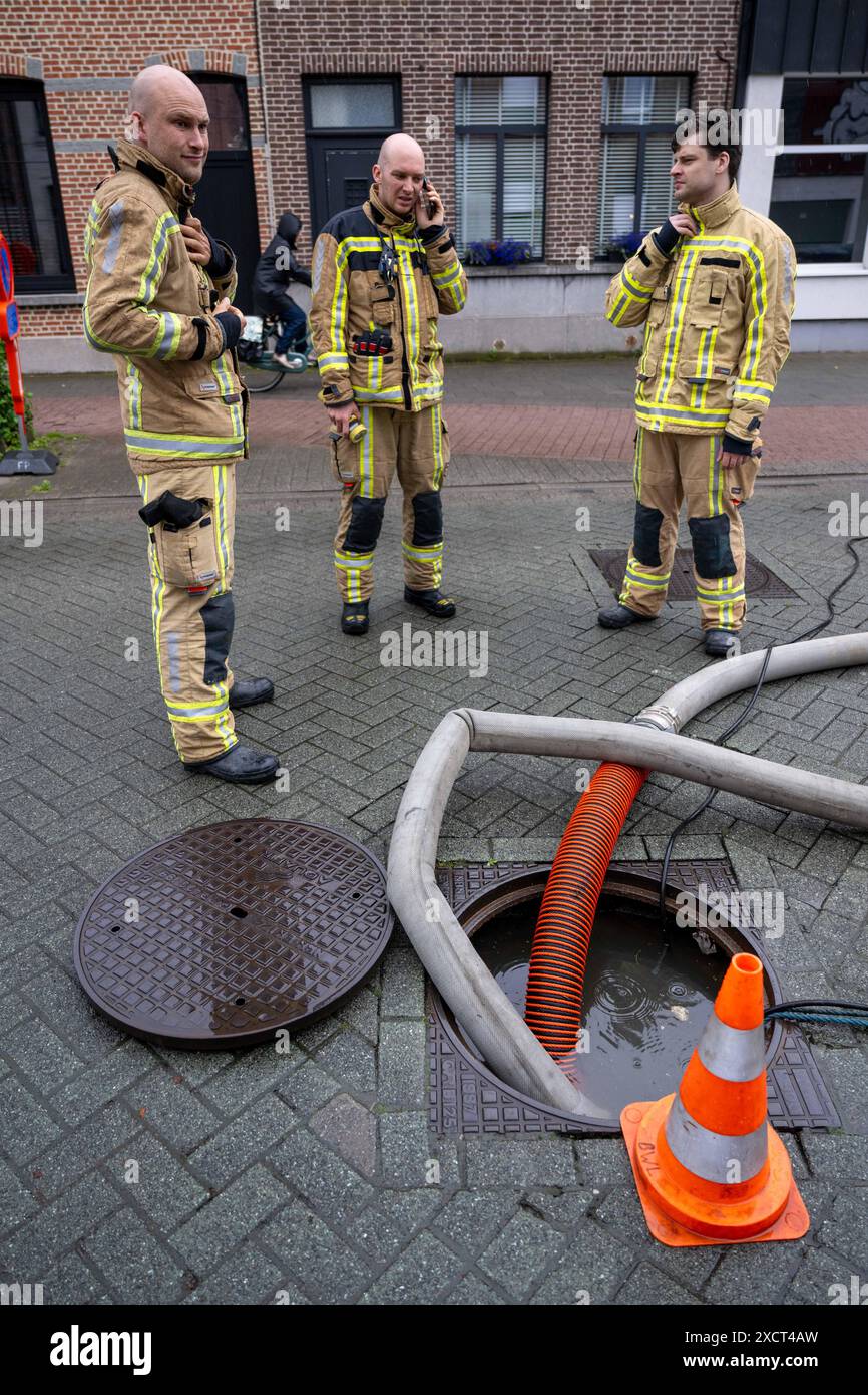 Lier, Belgium. 18th June, 2024. Firefighters work to clear flooded ...