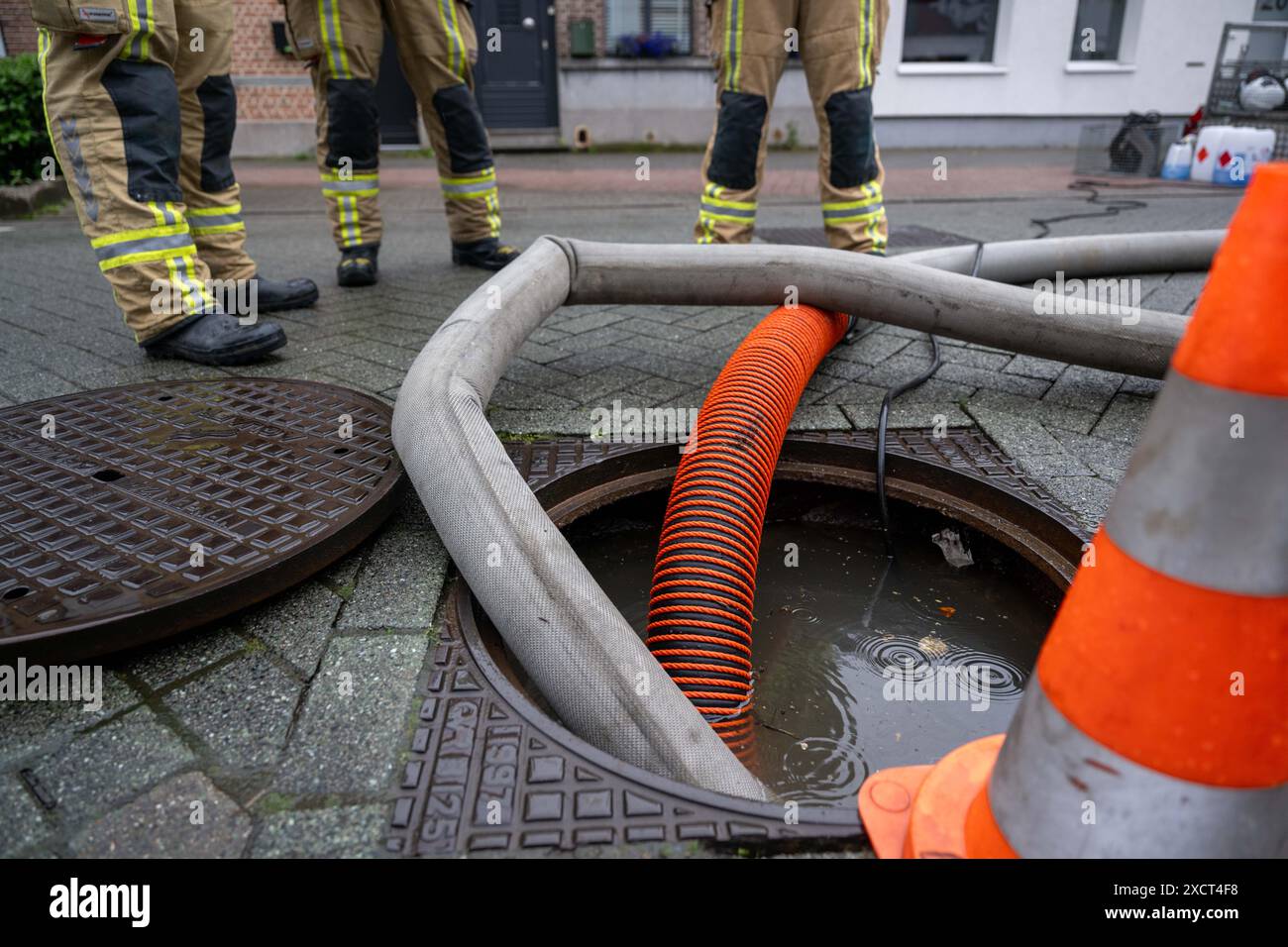 Lier, Belgium. 18th June, 2024. Firefighters work to clear flooded ...