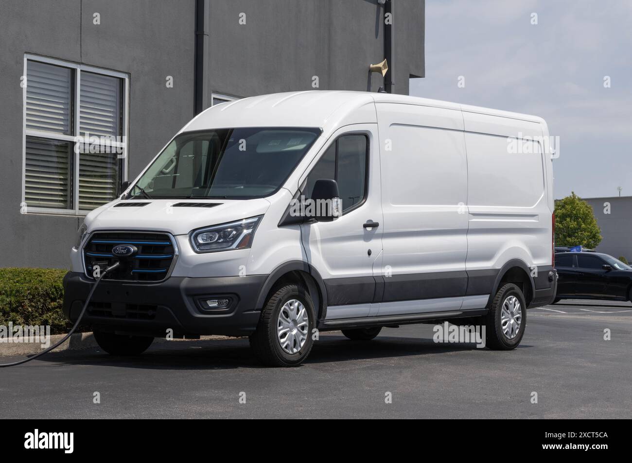 Plainfield - June 16, 2024: Ford E-Transit Cargo Van display at a ... Plainfield - June 16, 2024: Ford E-Transit Cargo Van display at a ...