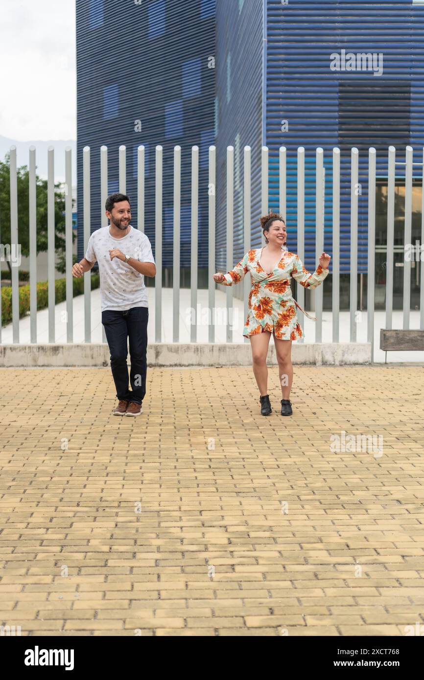 Cheerful woman happily dancing hi-res stock photography and images - Alamy